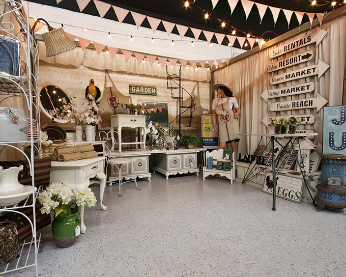 Step into a perfectly curated booth where farmhouse chic meets cottage core, complete with string lights that make everything look better.