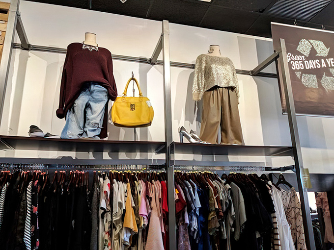 Perfectly styled mannequins showing off burgundy sweaters and that statement yellow bag &ndash; like visual fashion consultants who never judge your choices.