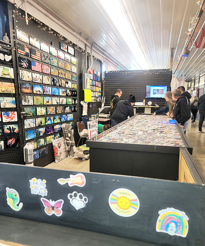 Wall-to-wall artistic expression where stickers meet creativity. Browsers linger at this stall, hunting for that perfect piece that speaks to their inner collector.