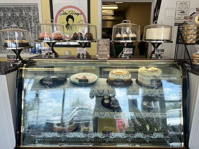 Behind this glass lies happiness measured in layers, frosting, and the willpower it takes not to press your face against it.