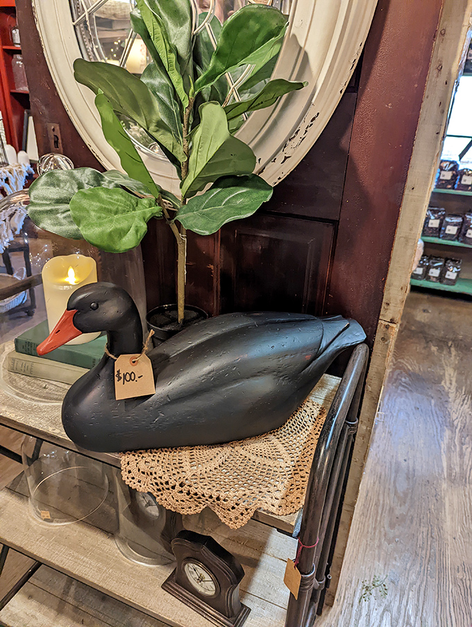 Not just any duck decoy&mdash;this handcrafted beauty brings a touch of rustic elegance to any home, perched on vintage lace.