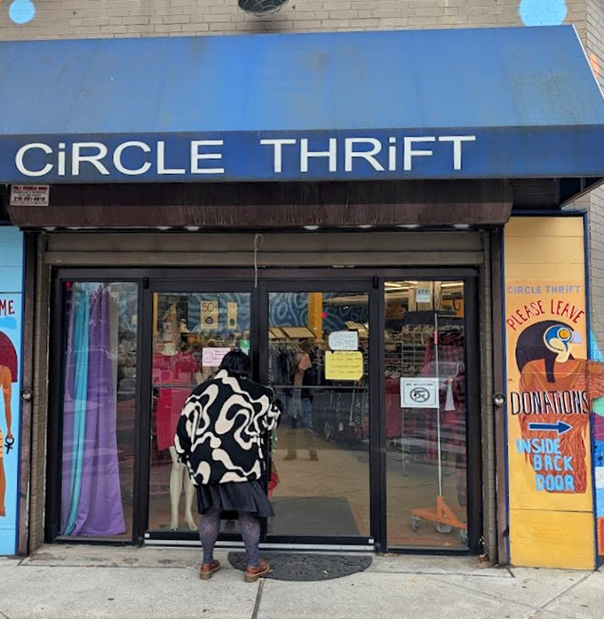 One person's castoffs become another's fashion statement. The entrance invites treasure hunters with its colorful mural and clear "donations welcome" signage.