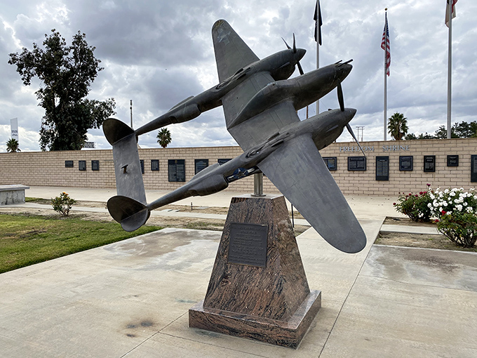 This P-38 Lightning monument captures the elegant twin-boom design that made this fighter a distinctive silhouette in World War II skies.