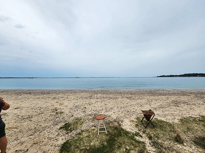 Beach chairs await storytellers and dreamers. The horizon stretches endlessly, promising adventures just beyond where the eye can see