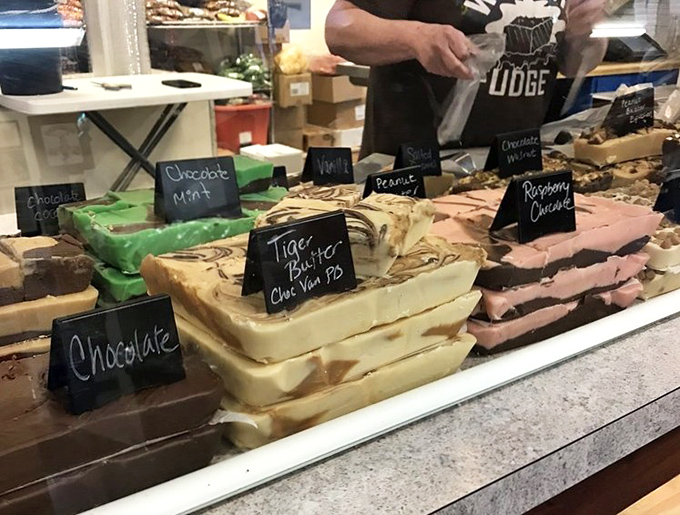 Handcrafted fudge varieties showcase genuine artistry - each flavor a testament to old-fashioned candy-making excellence.