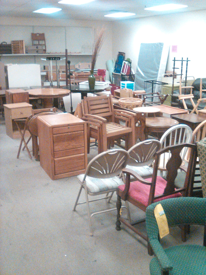 A furniture forest where every wooden chair tells a story. That teak folding table? It's seen more dinner parties than most caterers.
