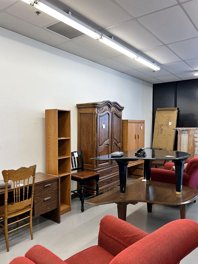 That armoire could tell stories, but the red chairs look ready to start new ones.