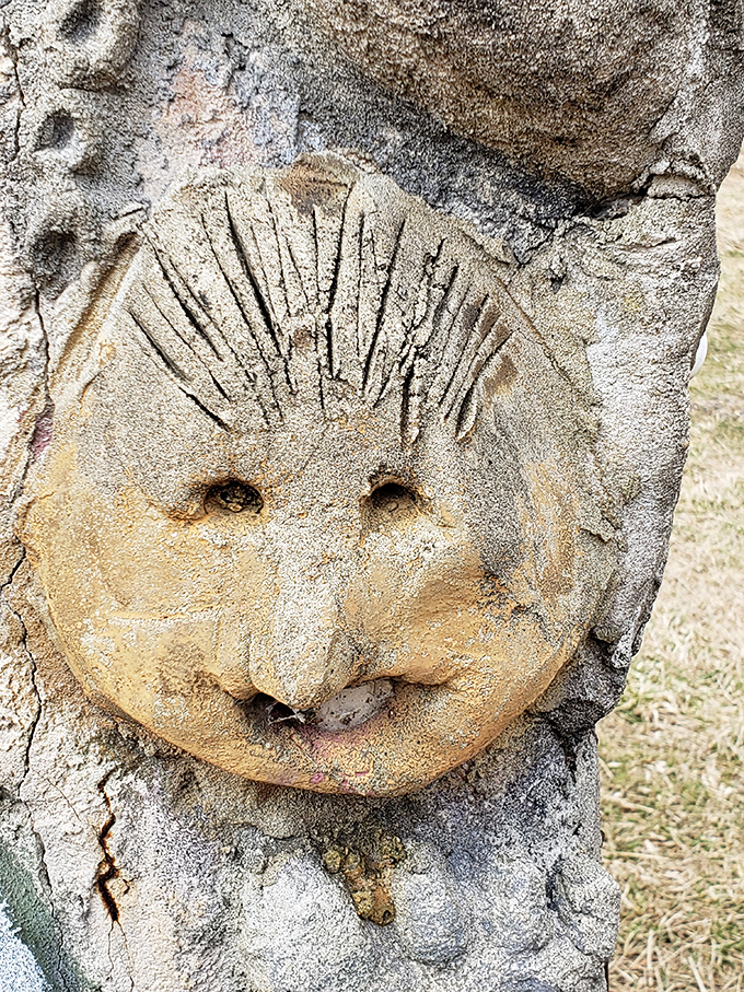 Expressions frozen in time&mdash;this haunting concrete face emerges from its earthy canvas with a serene gaze that follows visitors through the meadow.