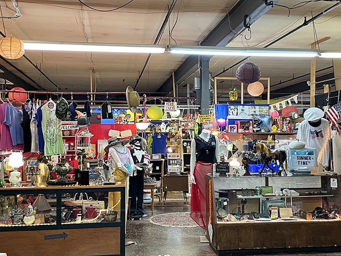 Fashion from another era stands at attention. Mannequins dressed in vintage clothing create a time-travel experience between the aisles.