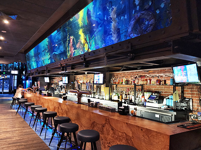 Not your average watering hole &ndash; Dive Bar's expansive aquarium hovers above patrons like a blue-hued halo of liquid magic.