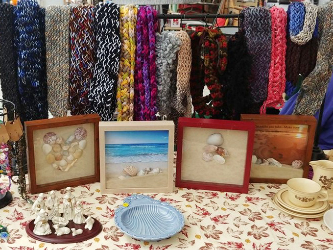 Handcrafted comfort meets beachside memories. These colorful scarves and seashell art bring warmth and vacation vibes to any home.