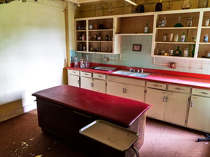 The kitchen's striking red countertops offer an unexpected pop of color, like finding lipstick in a ghost story.