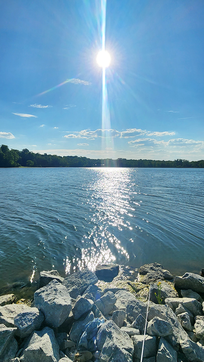 Sunlight dances across the water, creating a diamond pathway that seems to invite exploration.