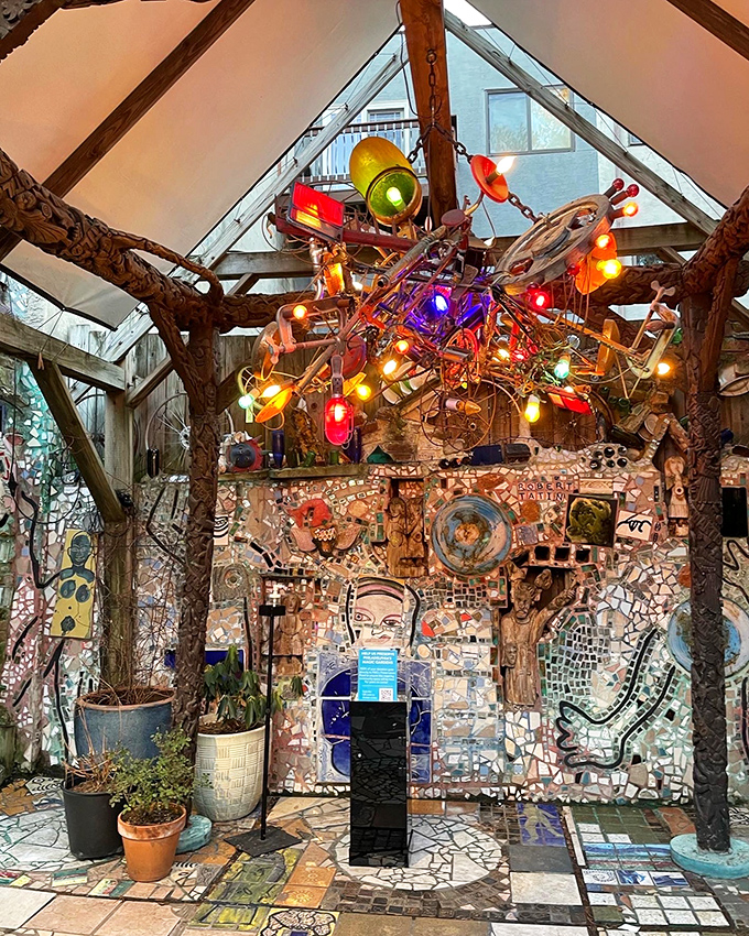 Even the ceiling gets the mosaic treatment, with colorful bottles and twinkling lights creating a whimsical chandelier that would make any home decorator jealous.