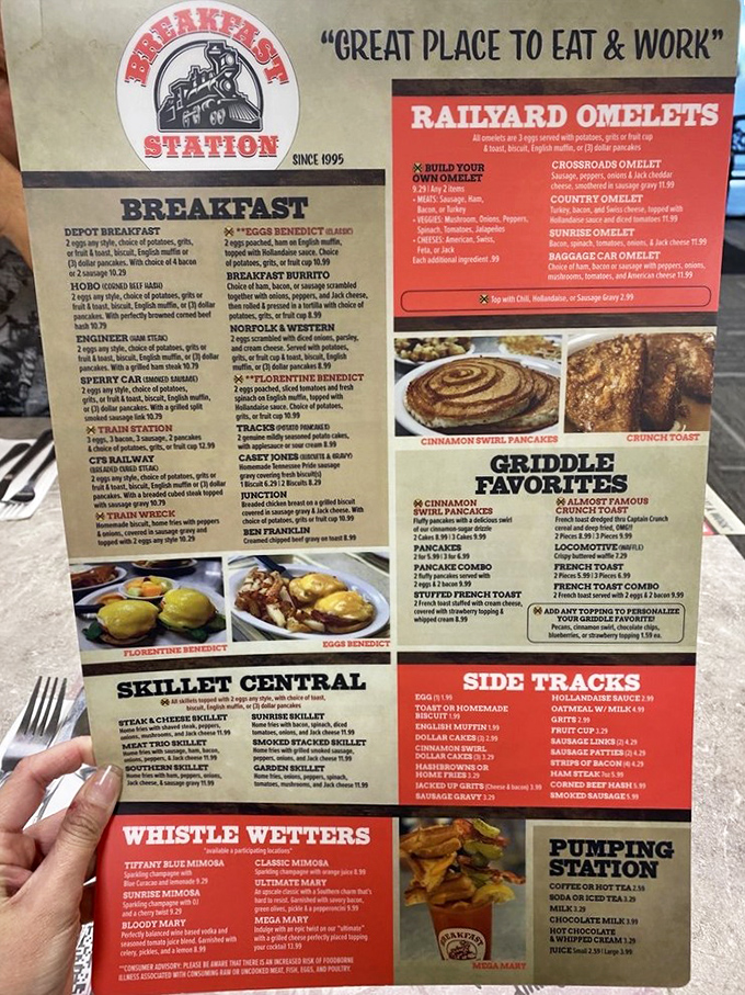 This isn't just a menu; it's a railroad-themed roadmap to happiness where "Railyard Omelets" and "Whistle Wetters" promise morning salvation.
