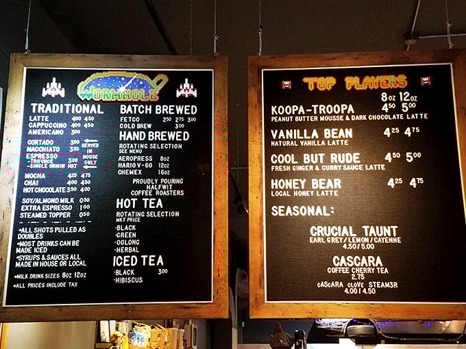 The menu board reads like an '80s arcade high score list, with specialty drinks named "Koopa Troopa" and "Cool But Rude." Game on, coffee lovers.