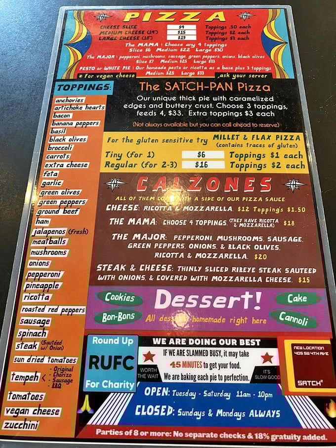 A menu that reads like a manifesto of pizza possibilities, complete with the legendary Satch-Pan that locals whisper about with reverence.