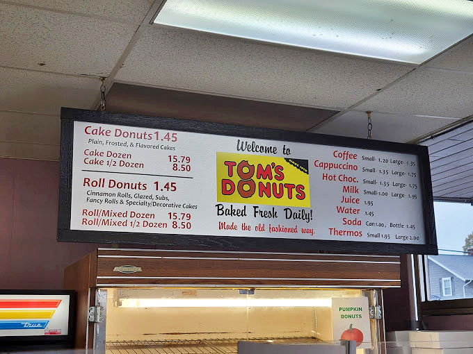 The menu board tells you everything you need to know &ndash; "Baked Fresh Daily" isn't just a slogan, it's the Tom's Donuts gospel.