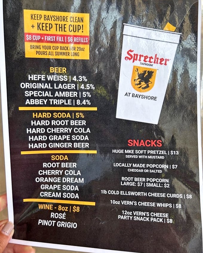 The menu board at Sprecher's Bayshore location reads like a bucket list for your taste buds. Hard root beer? Yes, please!