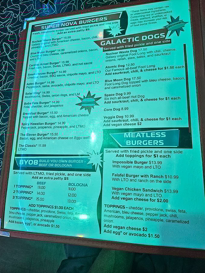 The menu reads like a sci-fi novel with delicious plot twists—from Nuclear Waste Burgers to Galactic Dogs, each dish promising its own adventure in flavor.