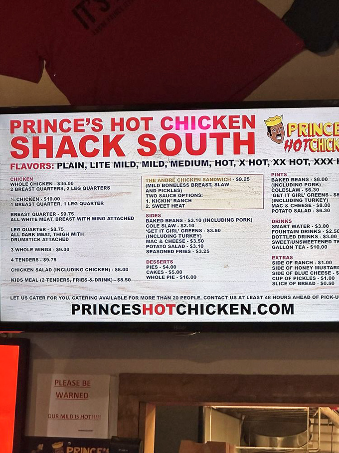 The sacred text of spice levels warns the uninitiated: "OUR MILD IS HOT!!!!" A menu board that doubles as a dare.