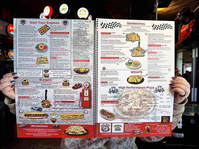 This isn't just a menu &ndash; it's a roadmap to culinary nostalgia with "Start Your Engines" appetizers and "High Performance Pizza" that'll make your taste buds do burnouts.