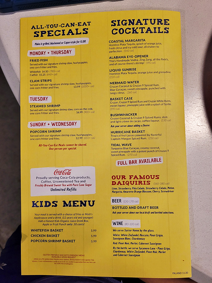 The vibrant yellow menu reads like a coastal treasure map, with all-you-can-eat specials that make Tuesday's steamed shrimp worth planning your week around.