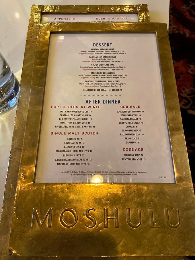 A dessert menu cradled in gold reminds you this isn't just any floating restaurant&mdash;it's maritime royalty serving pumpkin bread pudding and single malt scotches worthy of a captain's table.