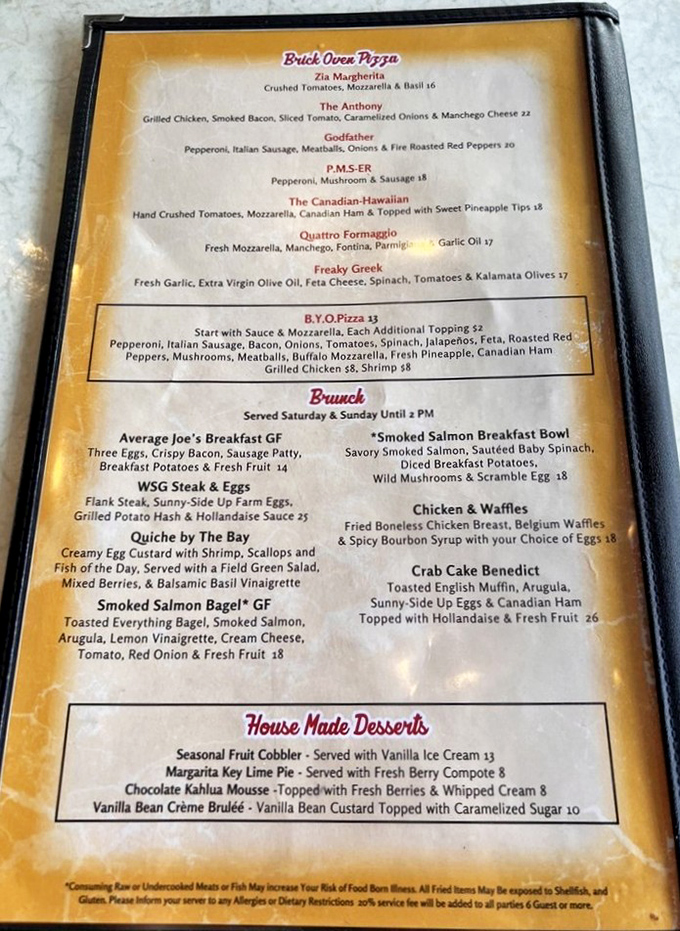 The menu reads like a love letter to your appetite. That brick oven pizza section? Pure temptation in Times New Roman.