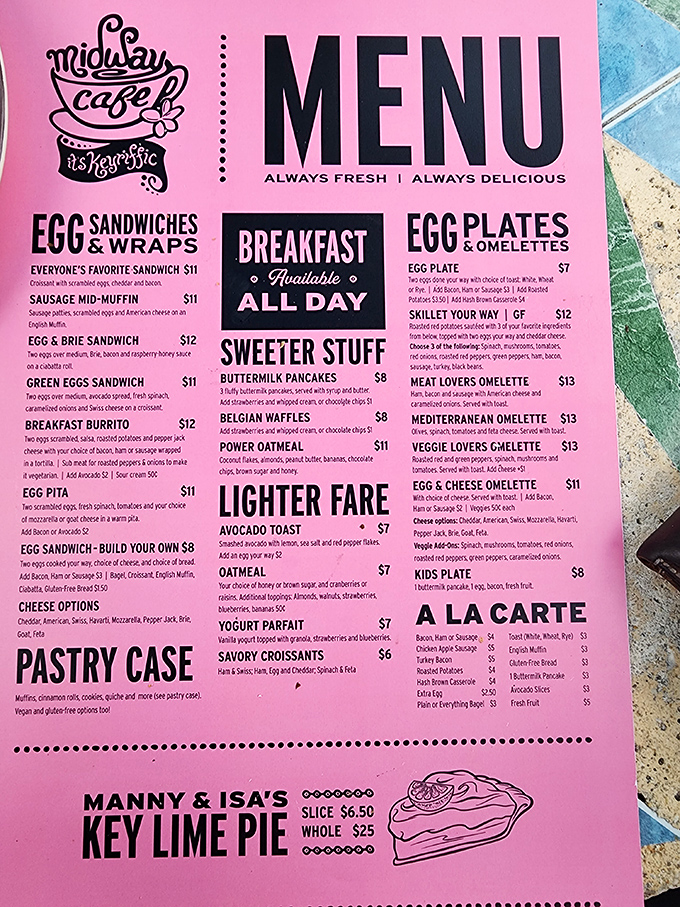 That pink menu isn't just pretty&mdash;it's a roadmap to happiness. Note the Key lime pie prominently featured at the bottom, like the headliner at a culinary concert.