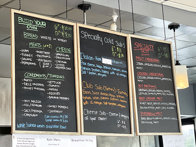 The holy trinity of menu boards—a sandwich lover's scripture. Build your own masterpiece or trust their time-tested specialties, either way your stomach wins.