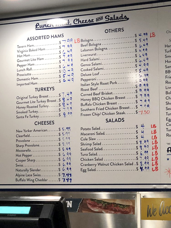 The menu board reads like a love letter to carnivores, with enough meat and cheese options to make a vegetarian question their life choices.