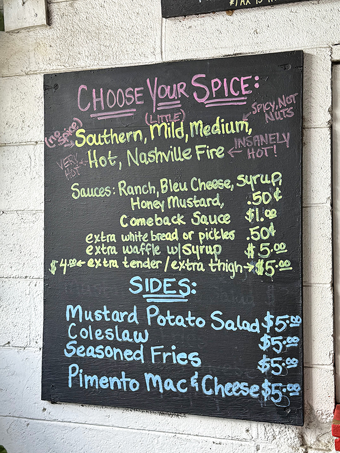 The spice level board is both menu and warning system. "Nashville Fire" isn't just clever marketing&mdash;it's a commitment that requires consideration and possibly medical insurance.