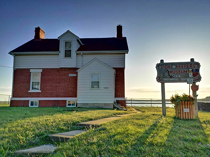 The Lightkeepers Museum stands sentinel against the sky, preserving tales of those who guided ships safely past Michigan's most beautiful but treacherous shoreline.