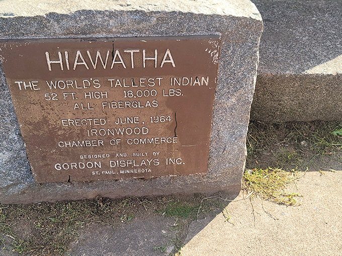 History cast in bronze: The plaque confirms what your neck already knows&mdash;this is indeed the "World's Tallest Indian" at a staggering 52 feet.