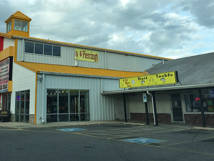 Beyond this unassuming exterior lies a world where fishing enthusiasts and body art aficionados somehow coexist in perfect retail harmony.