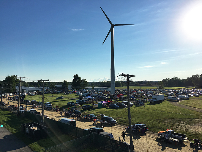 From this bird's eye view, the market's true scale reveals itself&mdash;hundreds of cars surrounding the fairgrounds like pilgrims at a retail shrine.