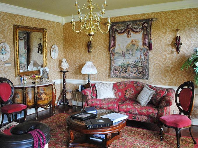 This parlor doesn't just whisper elegance&mdash;it practically recites poetry. The gold-framed mirror and tapestry transport you to another era entirely.