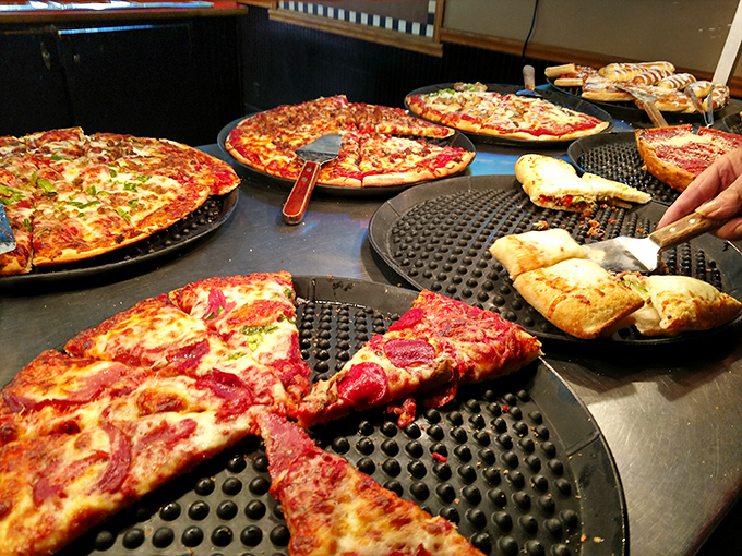 Behind the scenes magic happens as golden pizzas emerge from ovens like edible works of art.