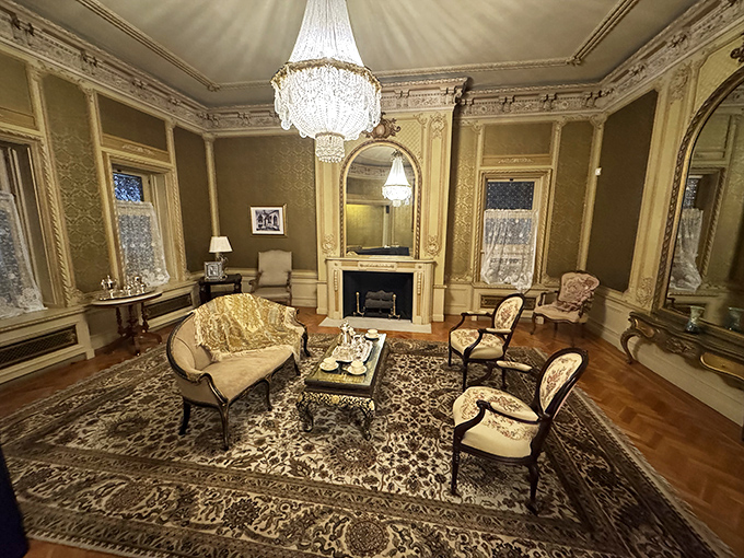This isn't just a living room&mdash;it's a masterclass in early 20th century opulence, where that chandelier alone probably cost more than my first house