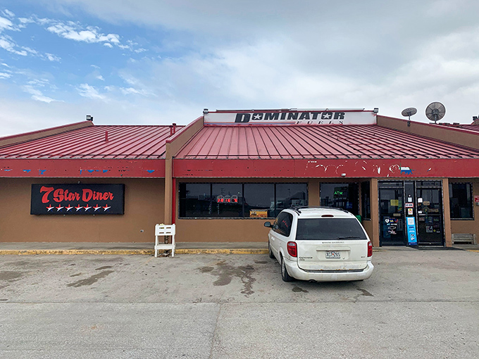 The 7 Star Diner's bright red roof serves as both landmark and promise &ndash; comfort food awaits inside, where calories don't count and coffee cups are never empty.
