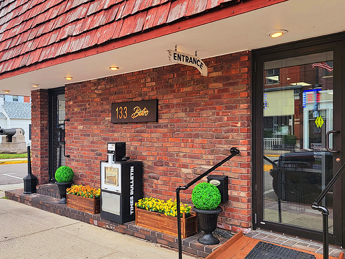 133 Bistro's entrance proves that sometimes the most memorable dining experiences hide behind unassuming brick facades. Those topiary balls add a touch of whimsy.