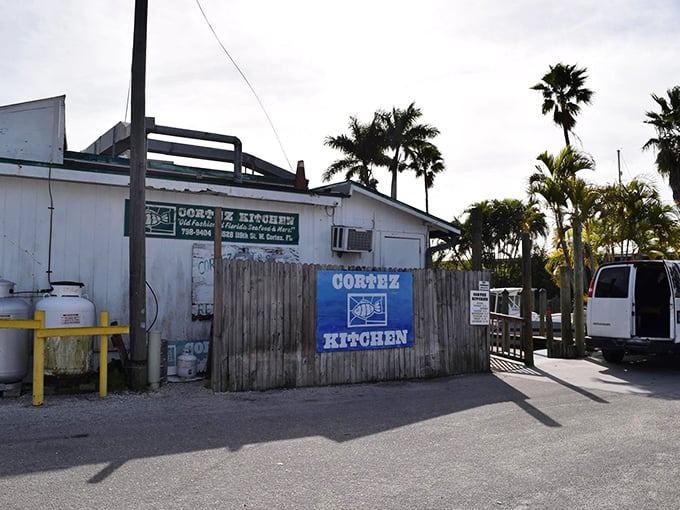 Behind this unassuming wooden fence lies Cortez Kitchen, where locals have been satisfying seafood cravings for generations. The best Florida restaurants often look the least impressive from the outside.