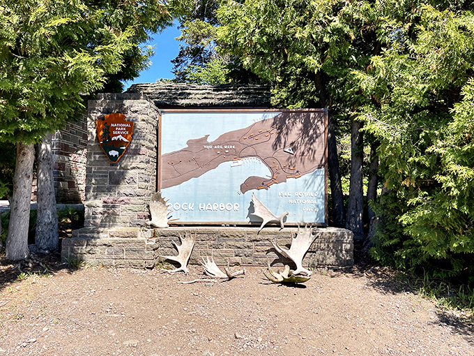 Maps don't capture magic, but this comes close. Rock Harbor's vintage sign orients visitors while moose antlers remind you who the real island locals are.
