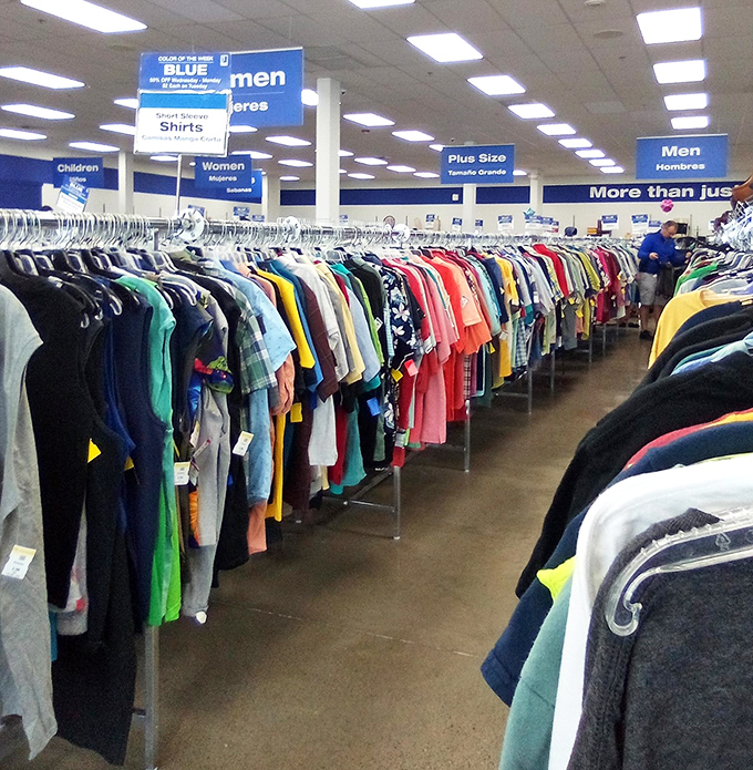 The men's clothing section stretches toward infinity. Each hanger holds not just a shirt, but someone's story waiting for a new chapter.