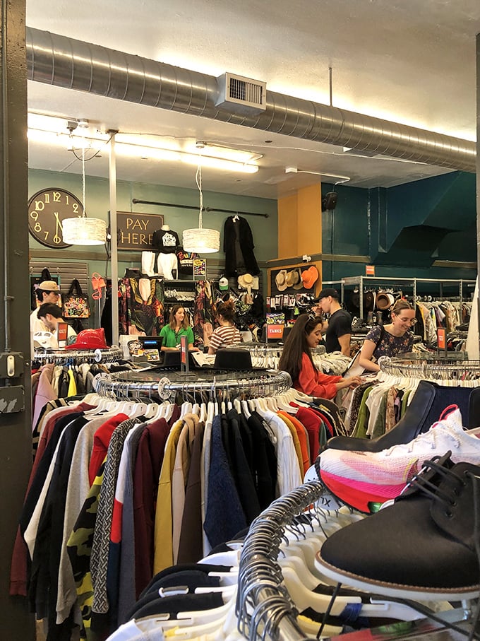 The thrill of the hunt in action&mdash;shoppers navigate the carefully curated wilderness of pre-loved fashion with focused determination.