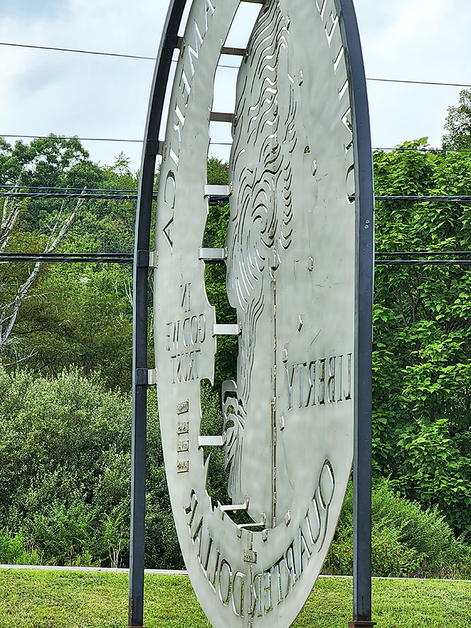 Peek through the artistic cutouts and you'll see Pennsylvania greenery beyond. The clever design turns a simple quarter into a window to the landscape.