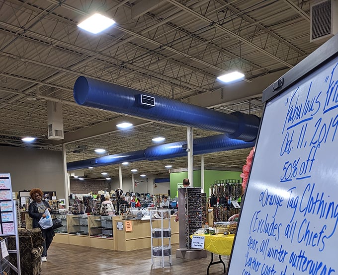 A glimpse into the treasure-hunting grounds where the blue ductwork overhead guides shoppers through departments of pre-loved possibilities.