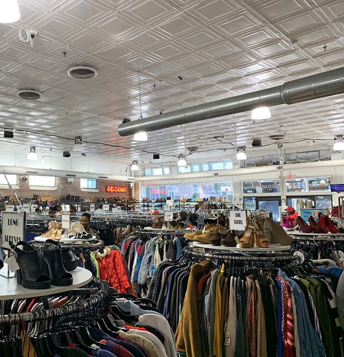 Beneath classic pressed tin ceilings, circular racks create a labyrinth of possibility where yesterday's fashion finds new admirers.