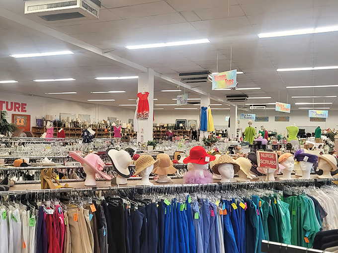 A rainbow of sun hats stands guard over color-coded clothing racks. Florida's fashion sense meets practical sun protection at prices that won't burn your budget.